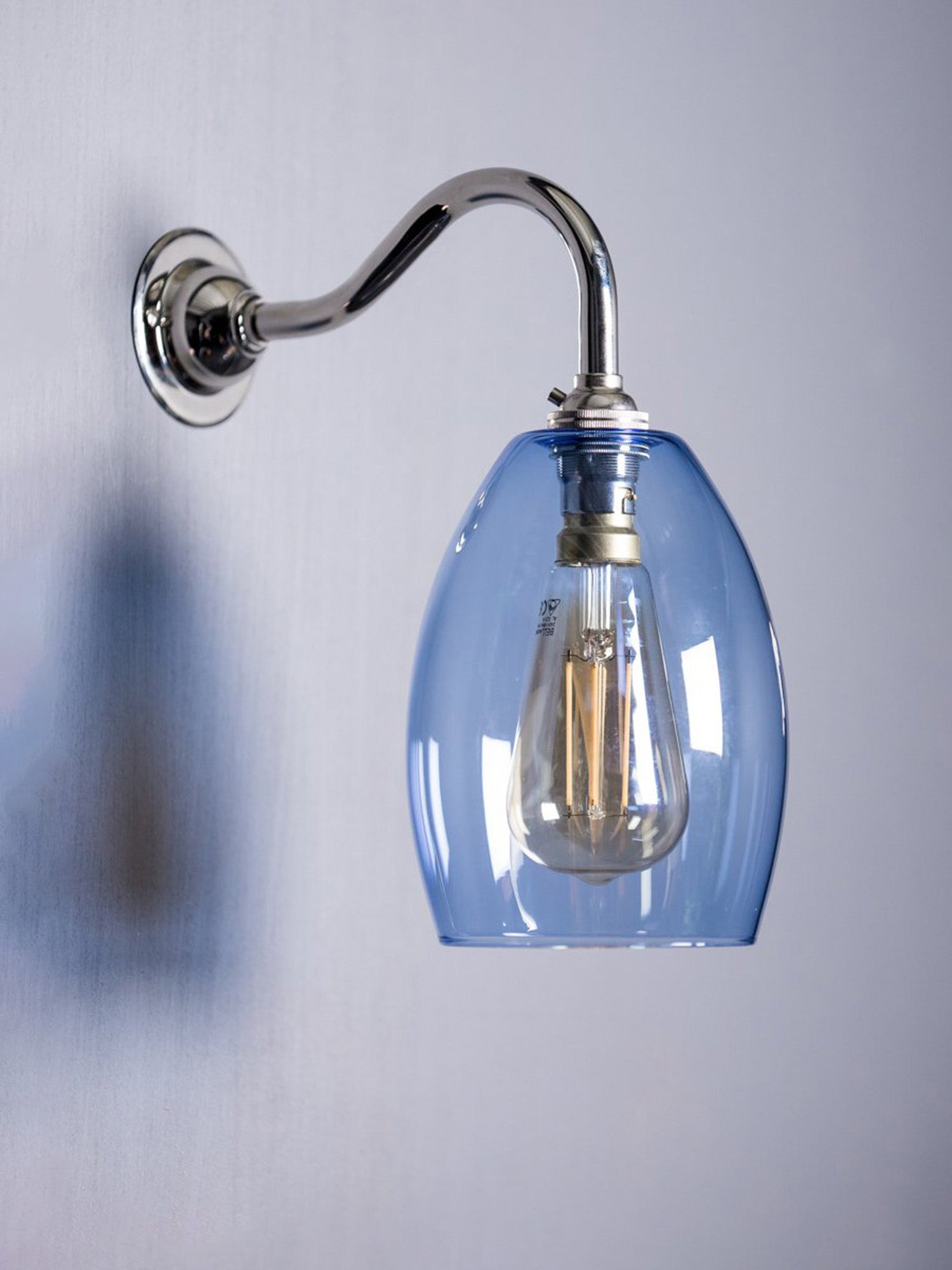 Classic Curve Pale Blue Glass Jules Wall Light – Glow Lighting